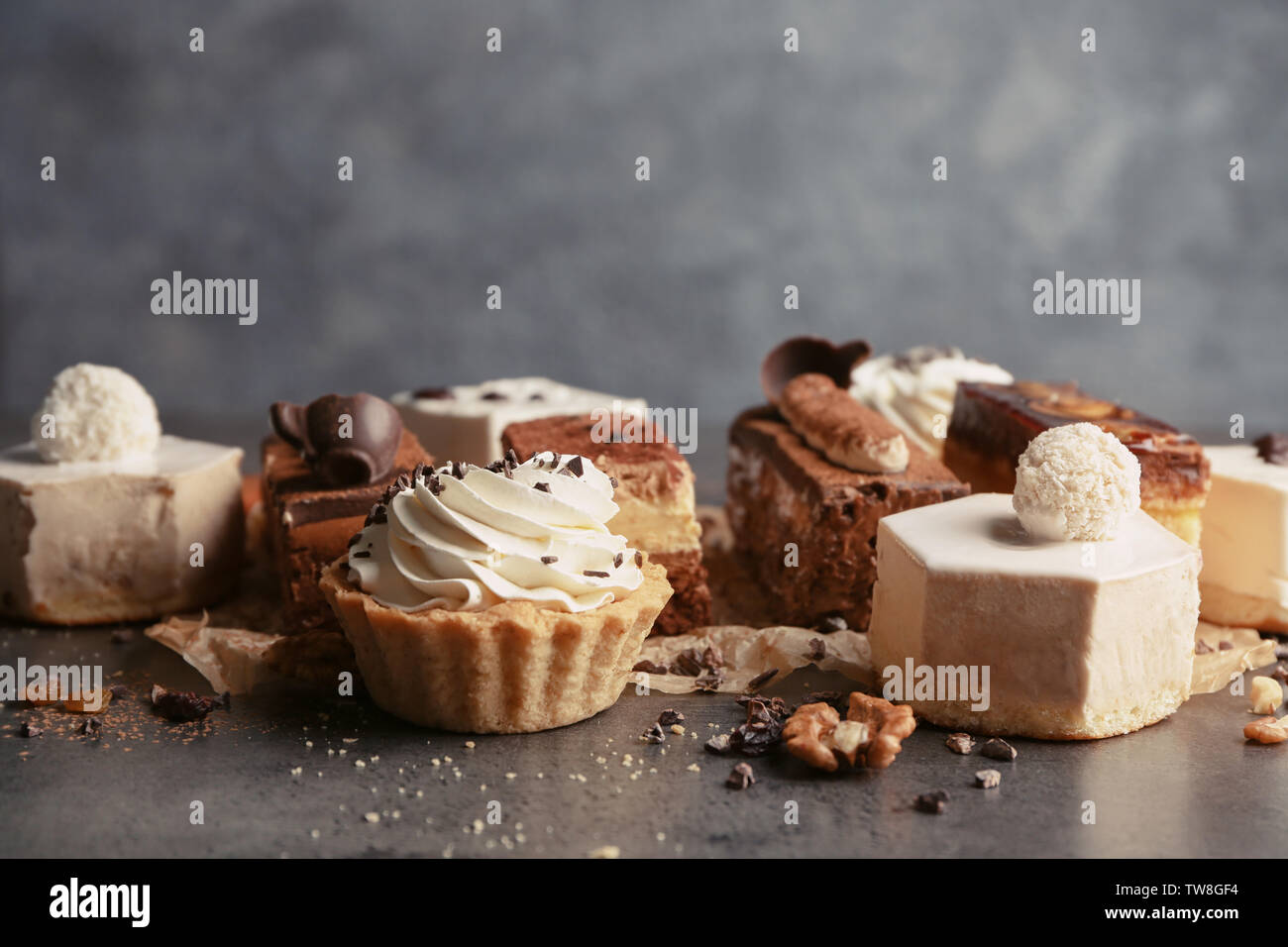 Assortment of tasty pastries on grey background Stock Photo - Alamy