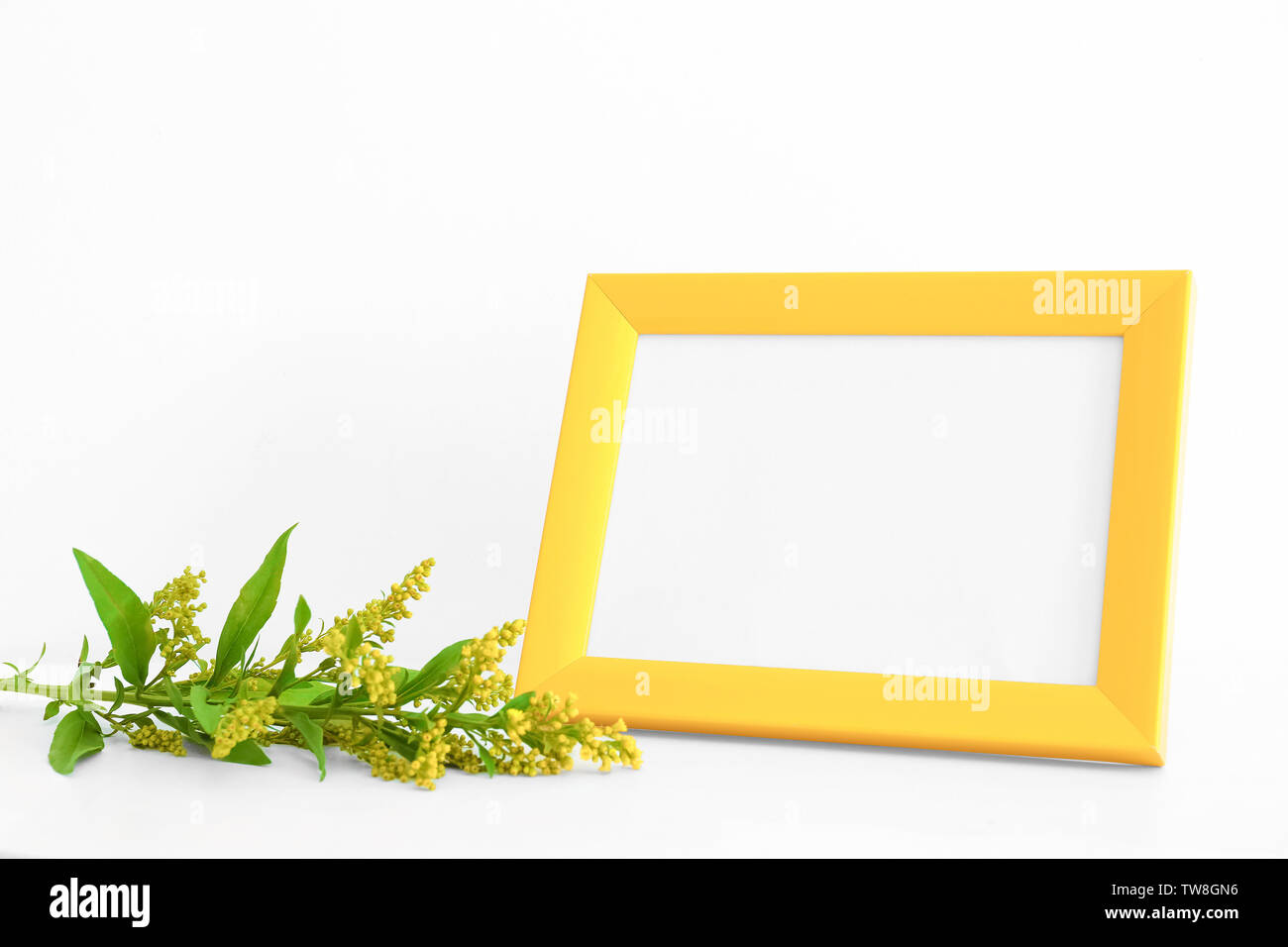 Yellow flowers photo frame interior hi-res stock photography and images ...