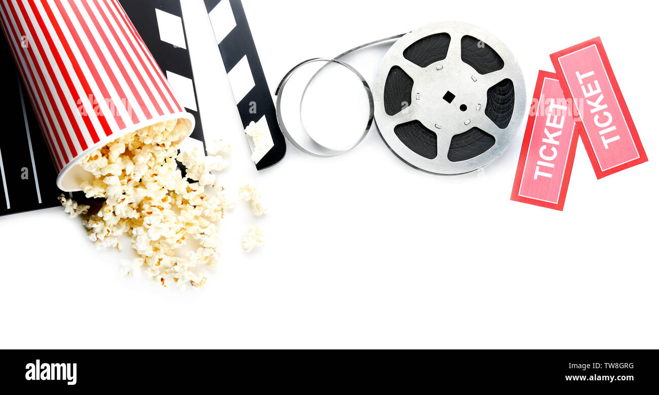 Composition with popcorn, movie clapper and cinema tickets on white ...