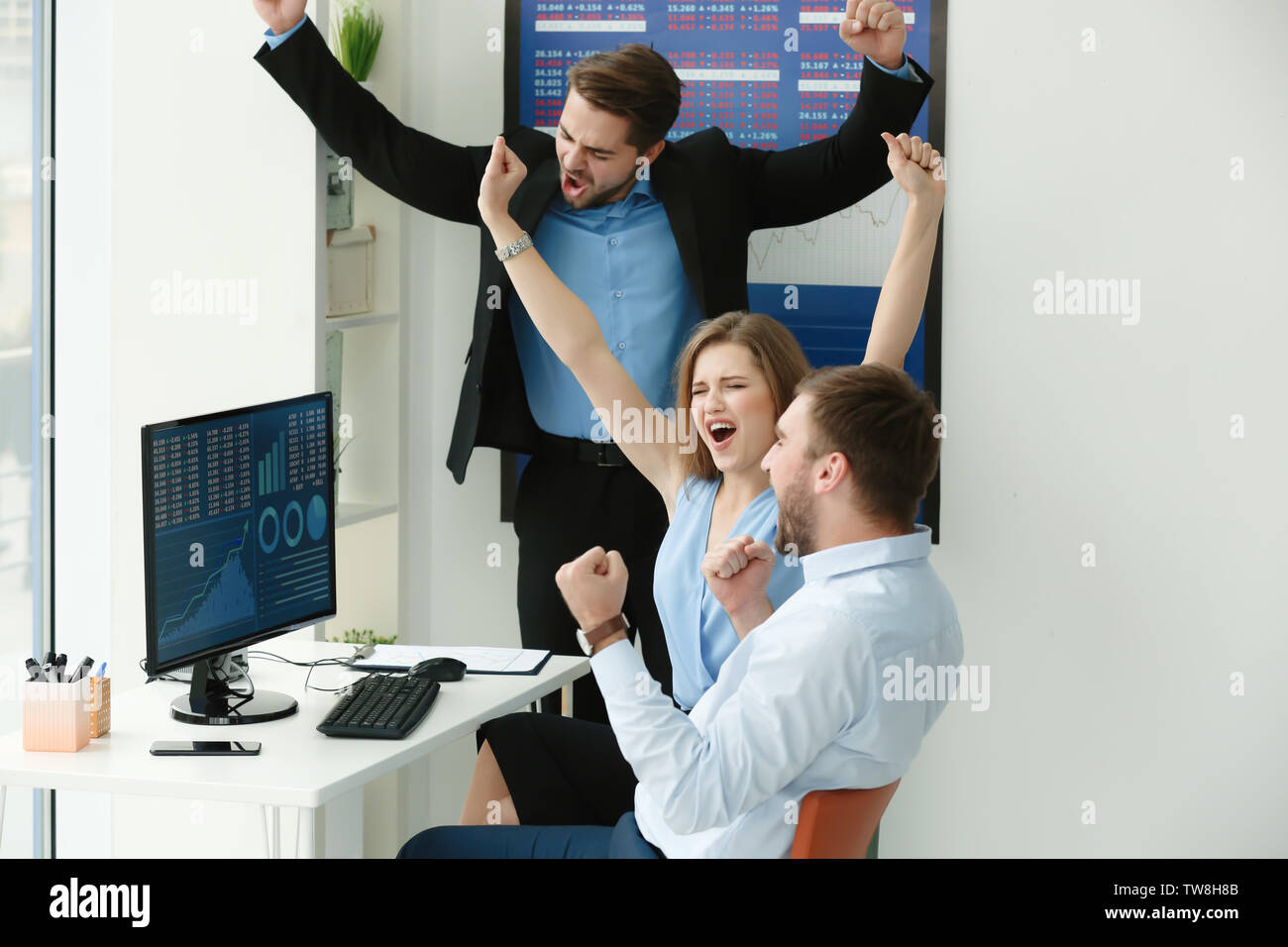 Stock traders celebrating hi-res stock photography and images - Alamy