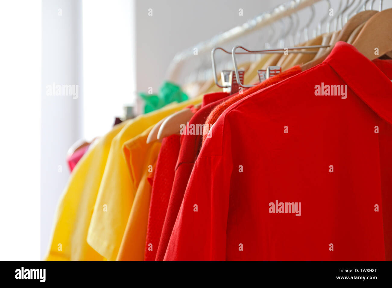 Rack with color clothes, close up Stock Photo - Alamy