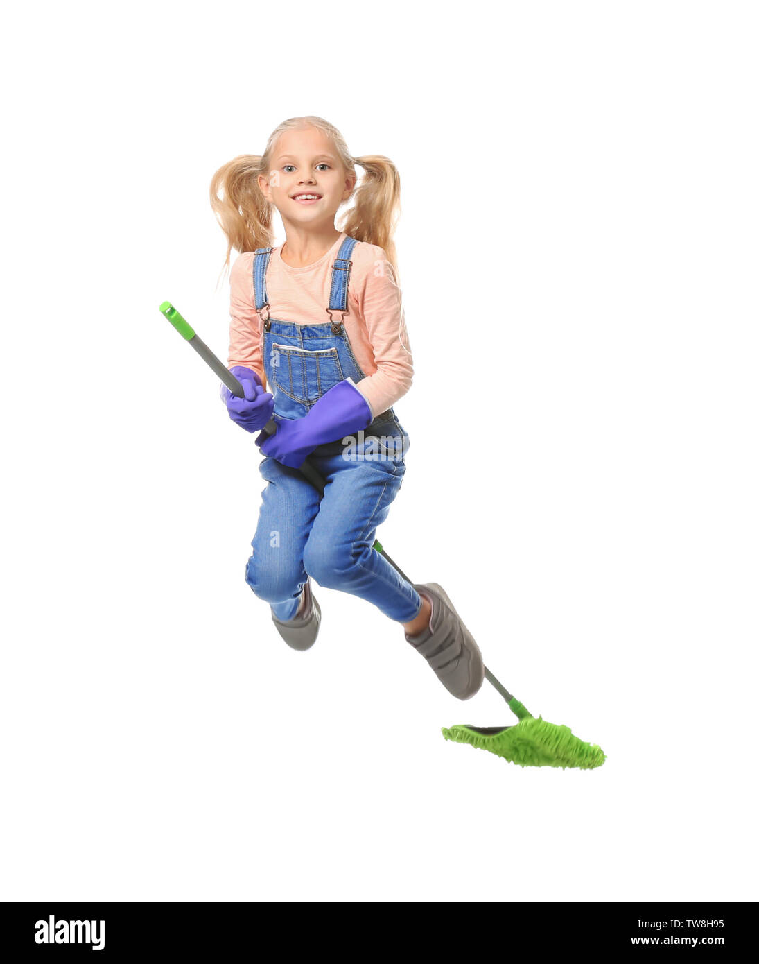 Cute little girl playing with mop on white background Stock Photo - Alamy