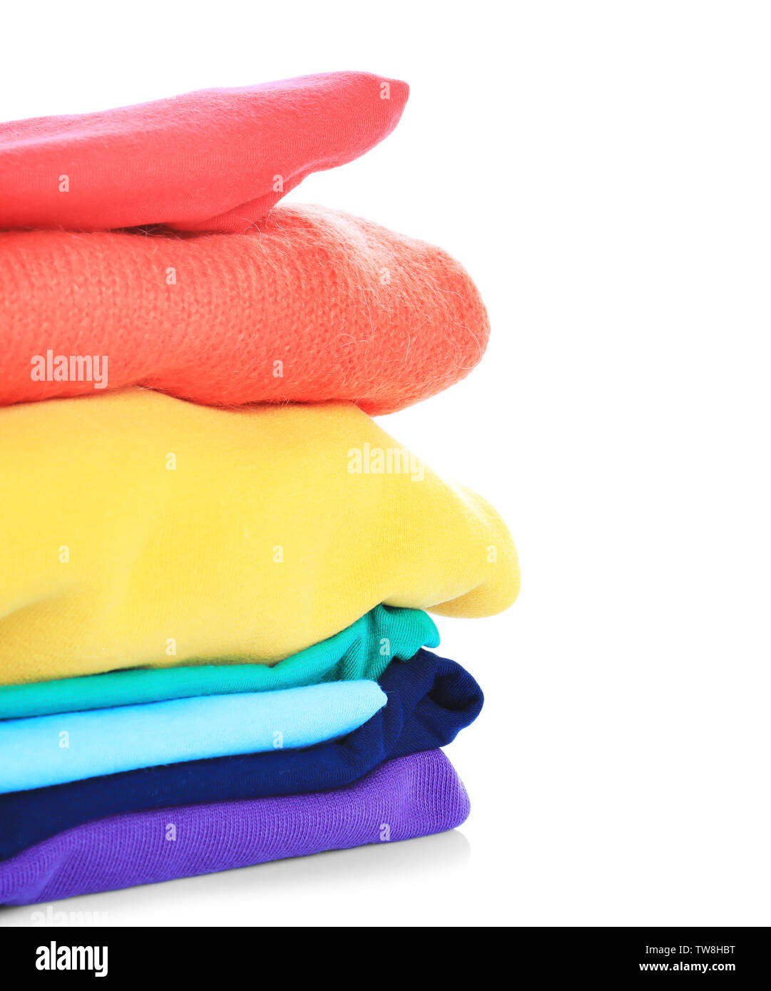 Folded rainbow clothes on white background Stock Photo - Alamy