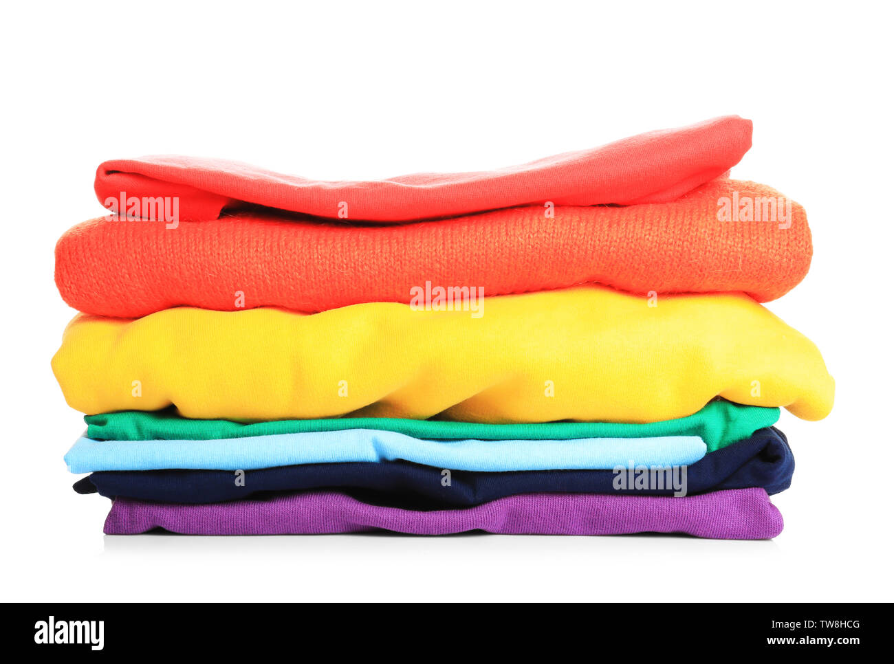 Folded rainbow clothes on white background Stock Photo - Alamy
