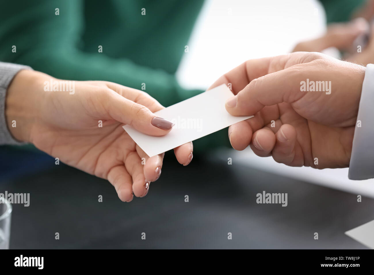 Notary giving business card to client in office Stock Photo - Alamy