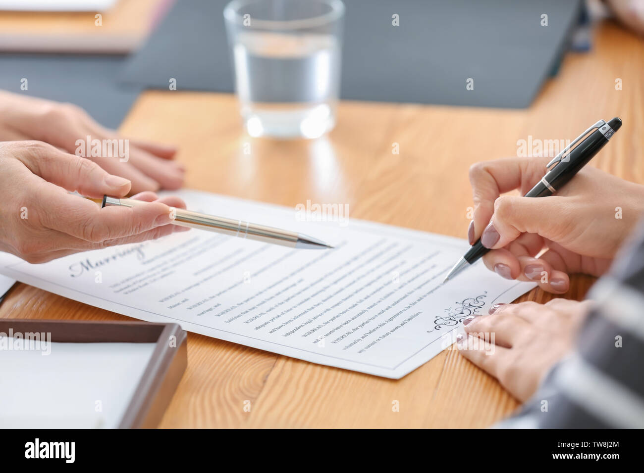 Signing of documents at notary public office Stock Photo - Alamy