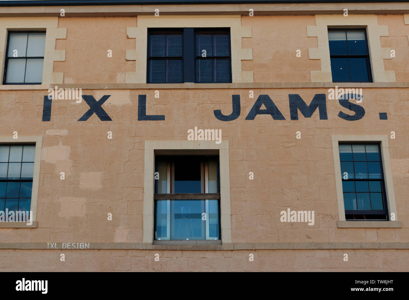 IXL Jams letters on old stone building on Hobart waterfront precinct ...