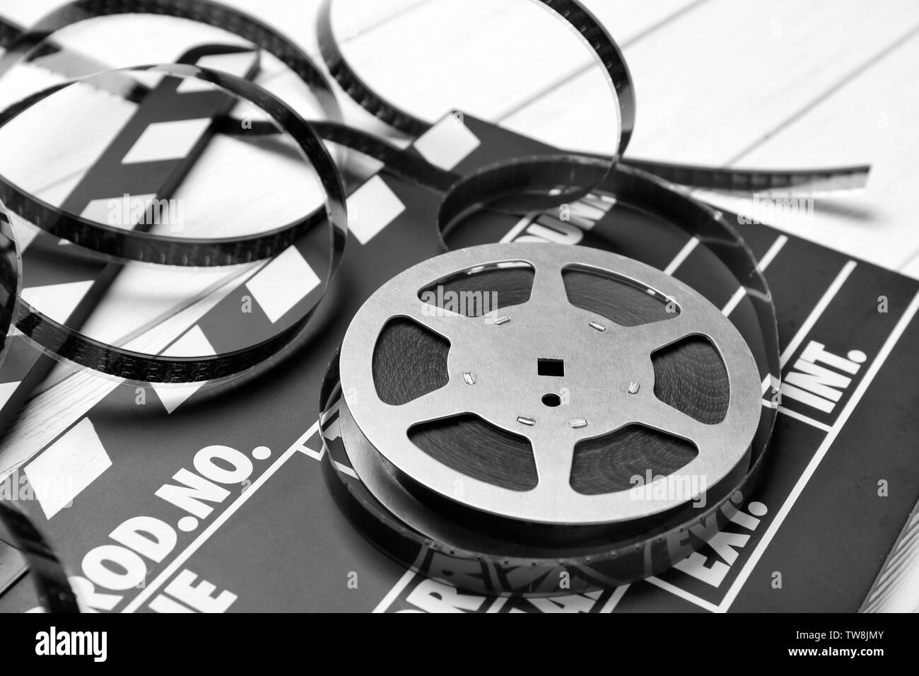Movie clapper and reel on light background, closeup Stock Photo - Alamy