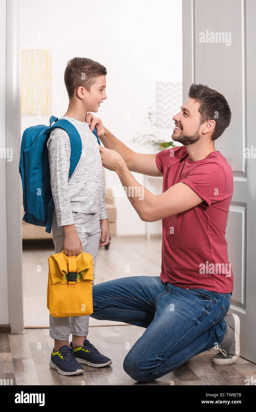 Young man saying goodbye to his son before school Stock Photo - Alamy
