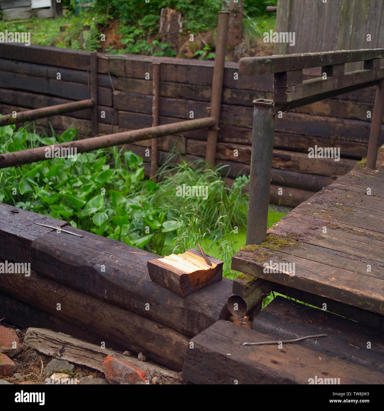 strengthening of the bridge made of squared beams across a trench Stock ...