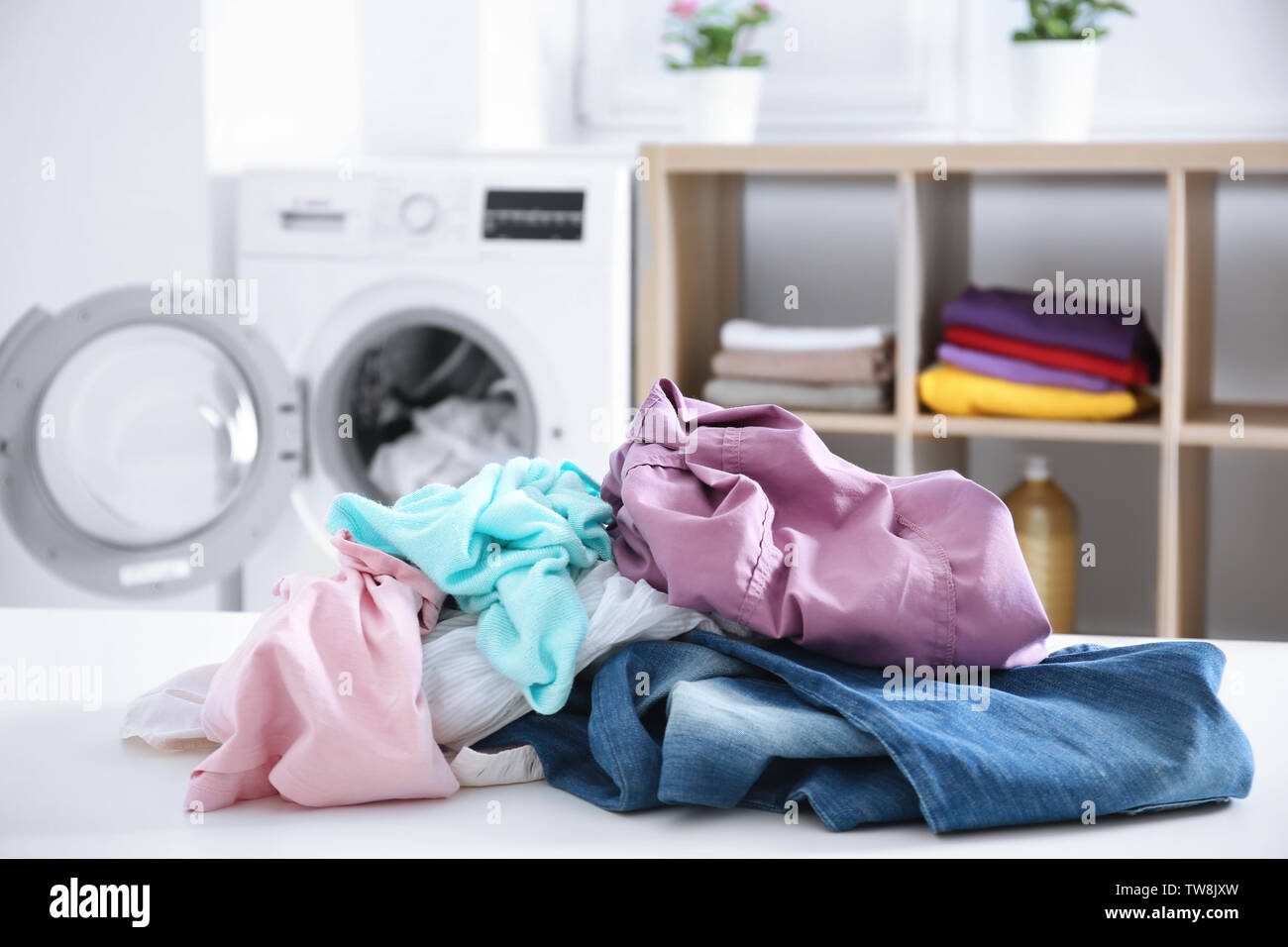 Pile of laundry in bathroom Stock Photo - Alamy
