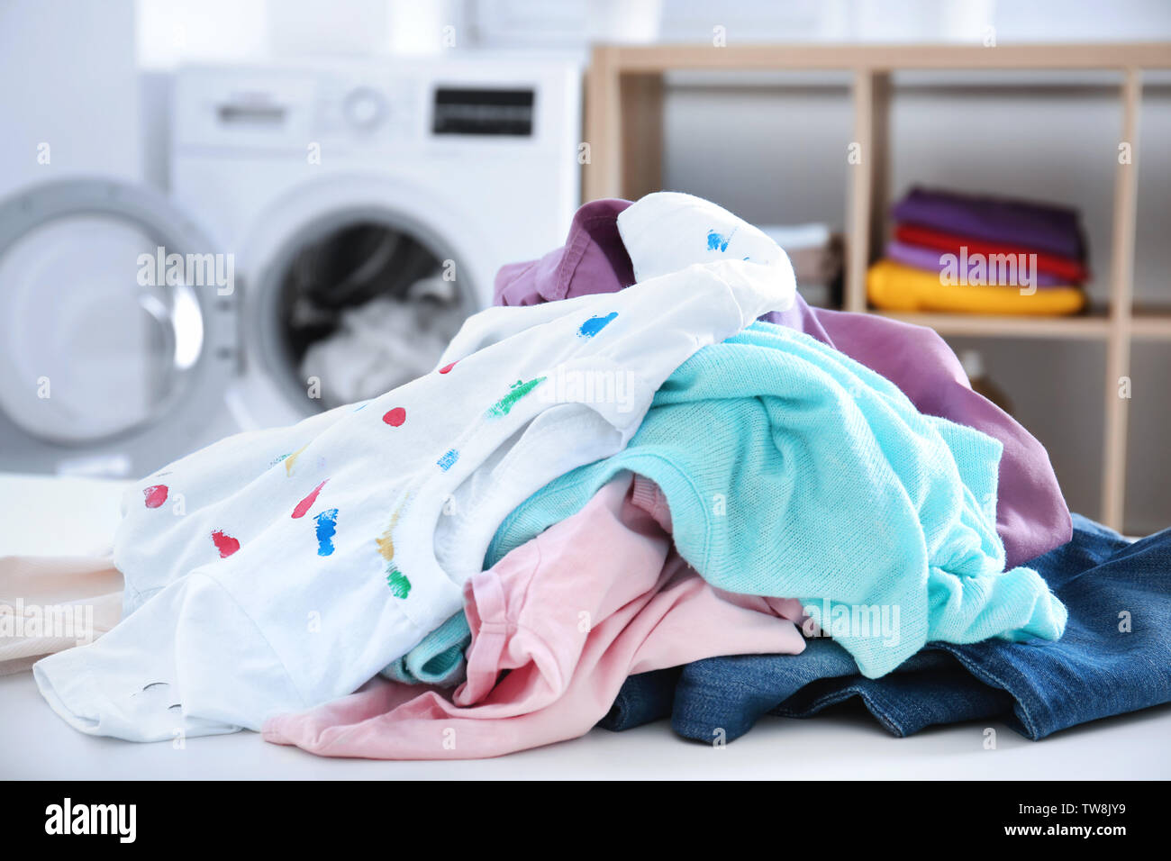 Pile of laundry in bathroom Stock Photo - Alamy