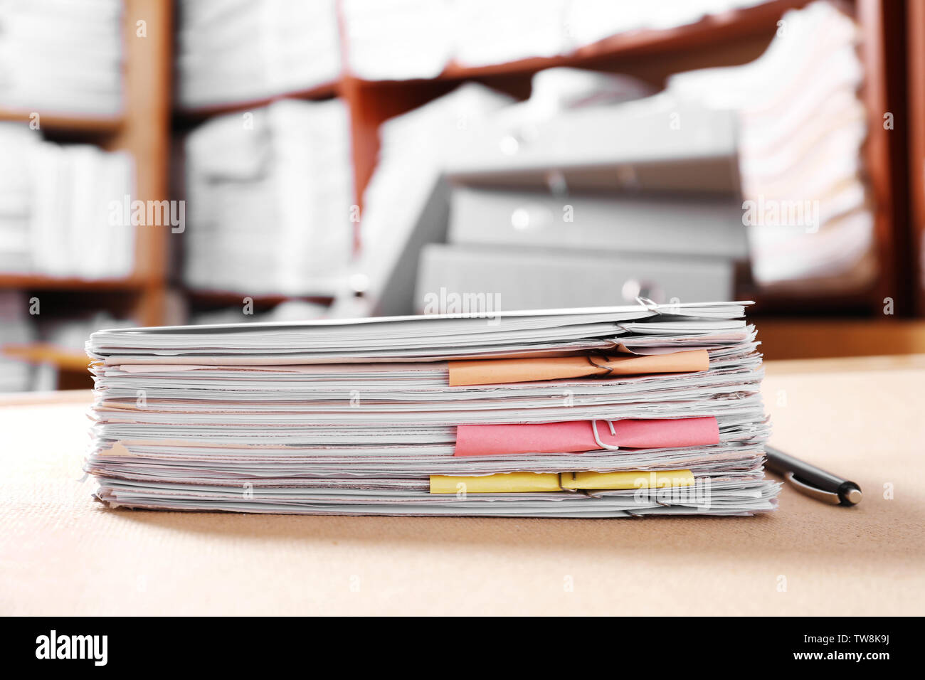 Stack of old paper documents on table in archive Stock Photo - Alamy