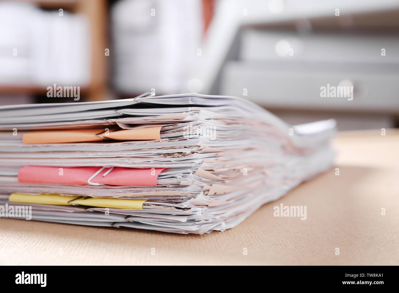 Stack of old paper documents on table in archive Stock Photo - Alamy