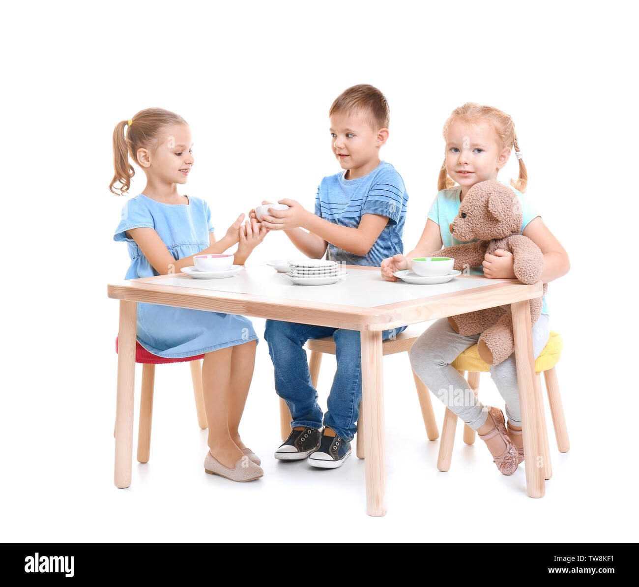 Cute little children playing on white background Stock Photo - Alamy