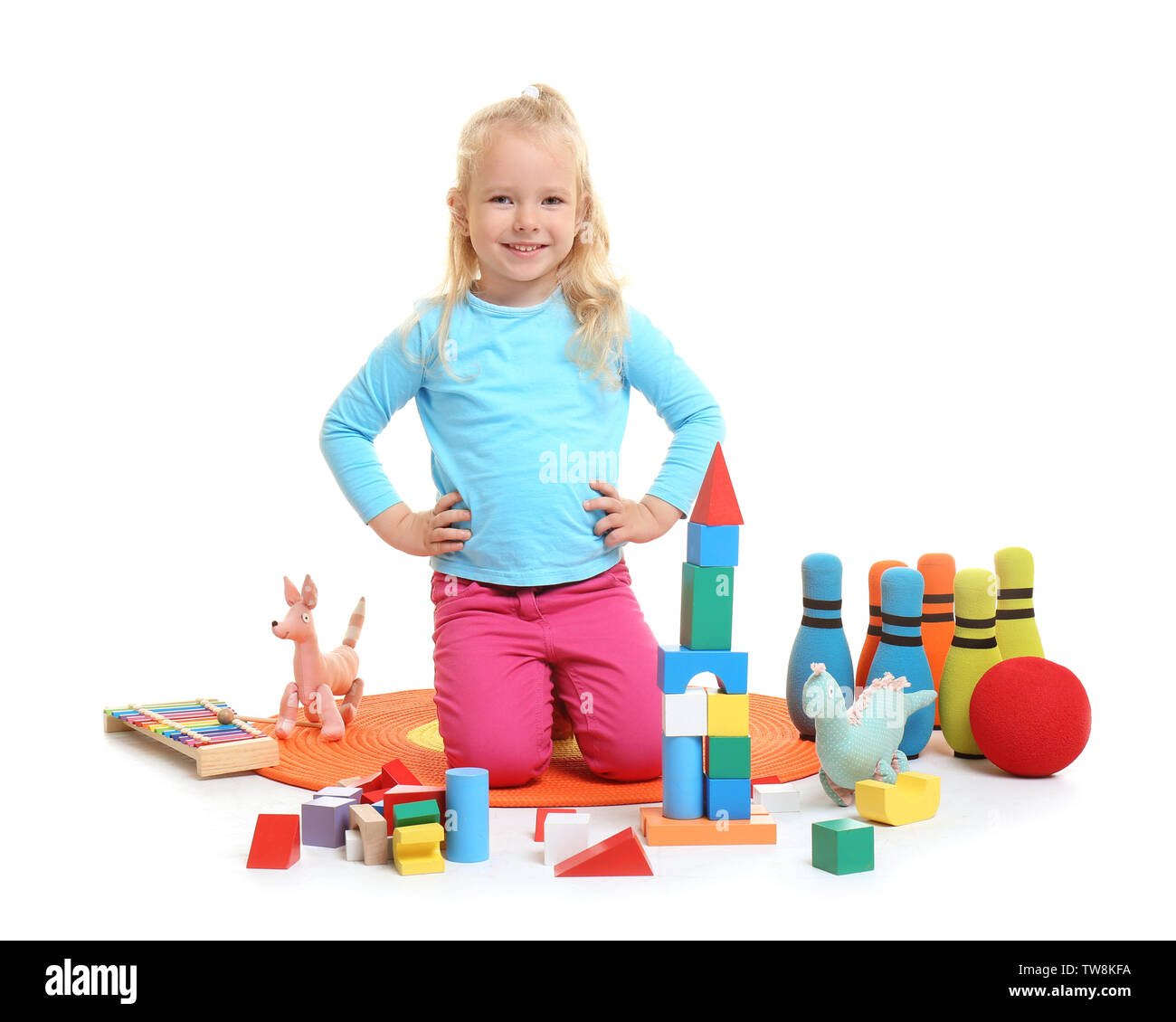 Cute little girl playing with building blocks on white background Stock ...