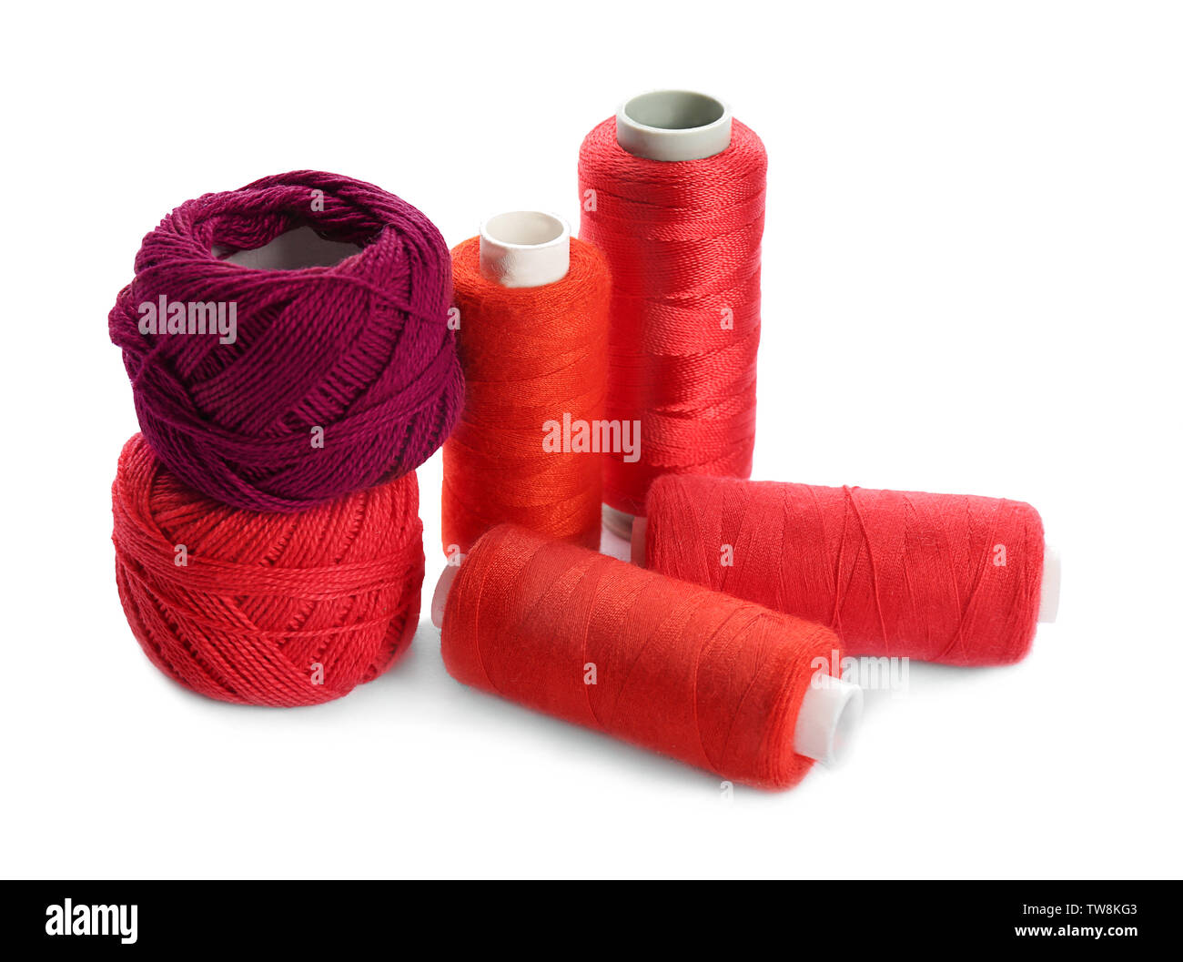 Red threads of different shades on white background Stock Photo - Alamy