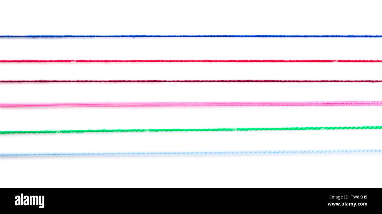 Colorful threads isolated on white Stock Photo - Alamy