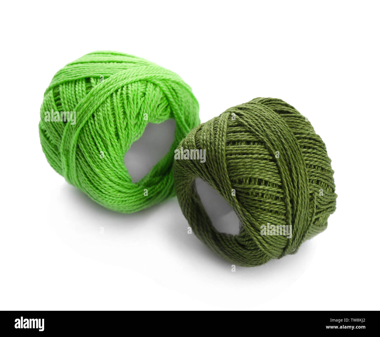 Green threads of different shades on white background Stock Photo - Alamy