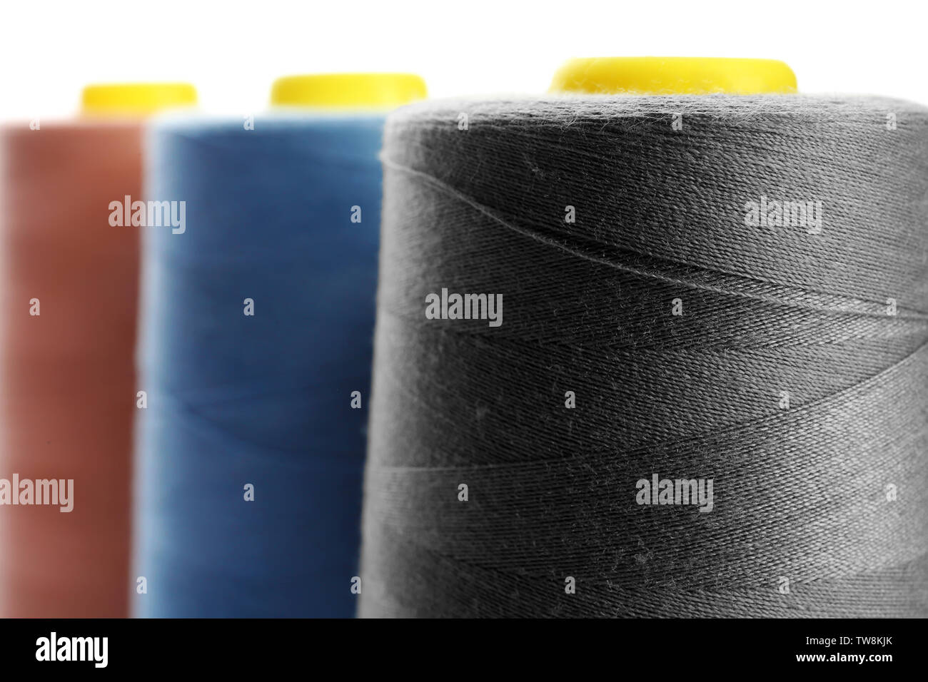 Dark grey thread bobbin, closeup Stock Photo - Alamy