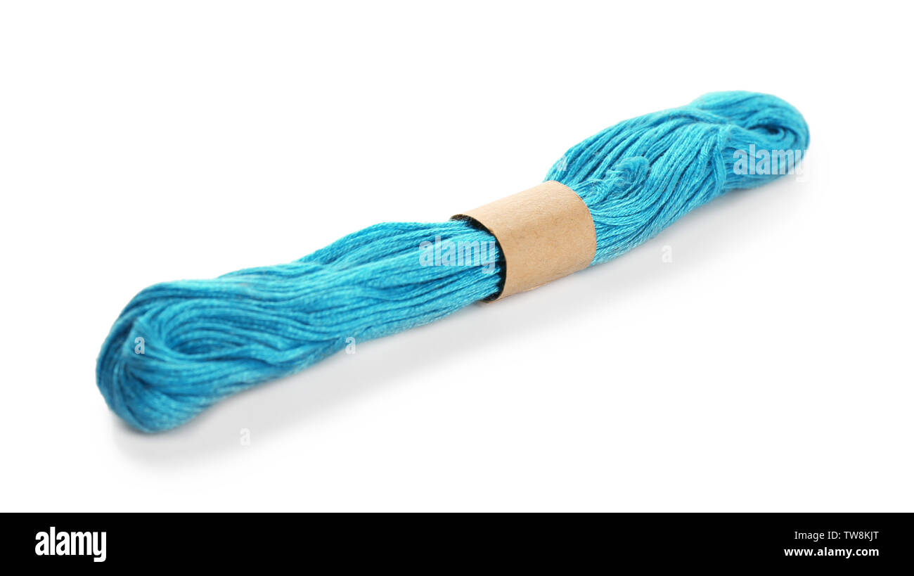 Blue embroidery thread on white background Stock Photo - Alamy