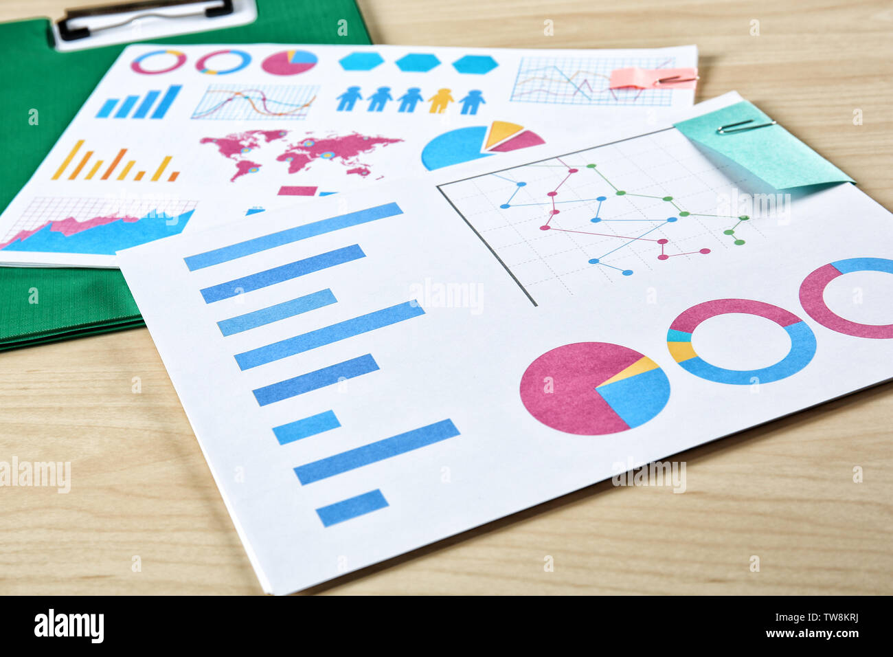 Documents with graphs and charts on table Stock Photo - Alamy
