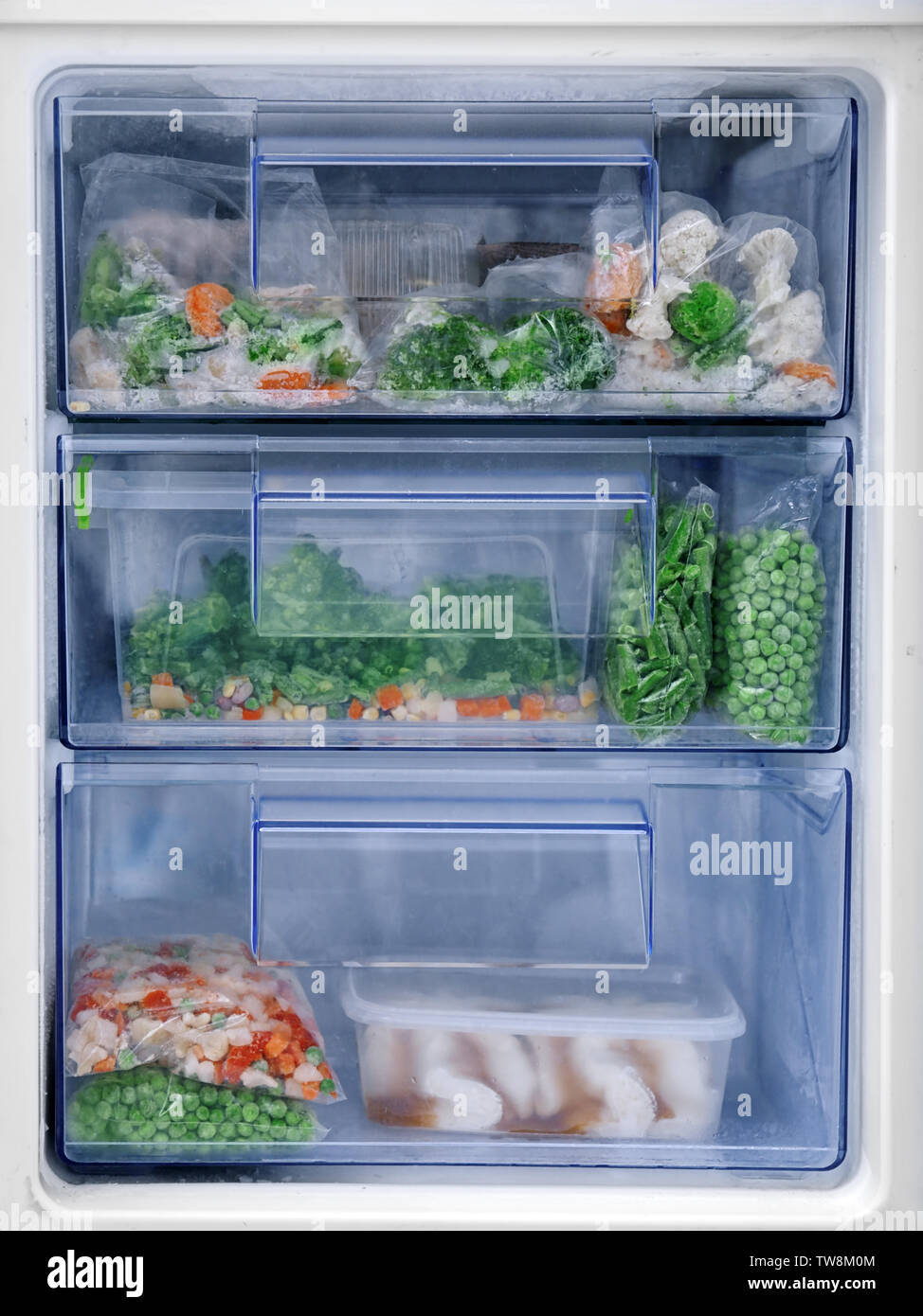 Different vegetables in refrigerator freezer Stock Photo - Alamy