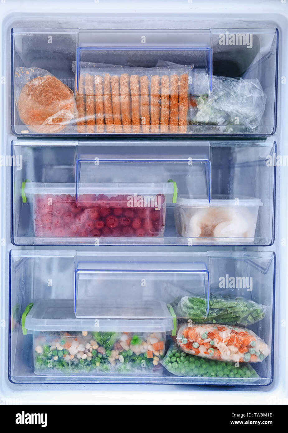 Different products in refrigerator freezer Stock Photo - Alamy