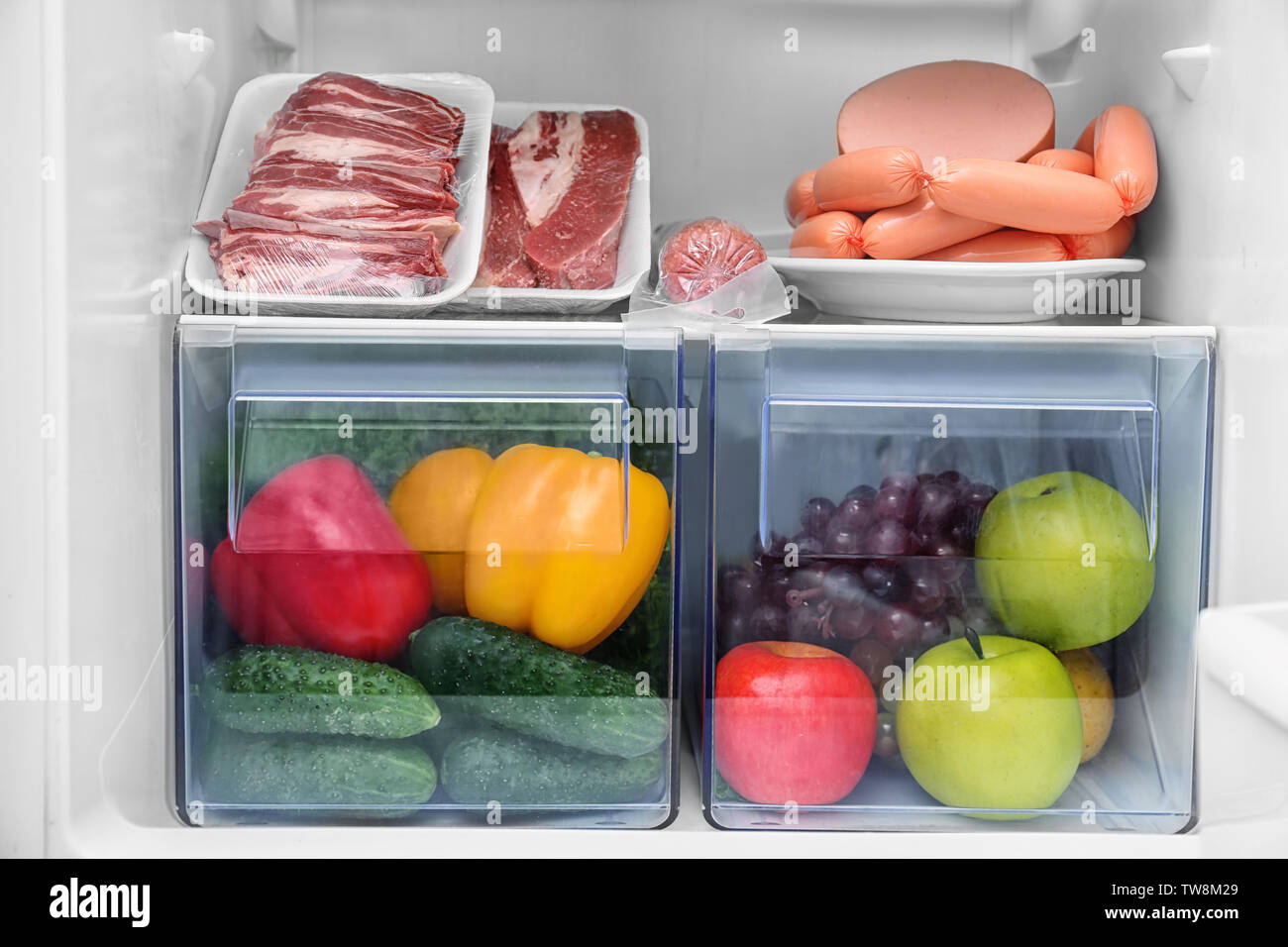 Meat products, fruit and vegetables in refrigerator, closeup Stock ...