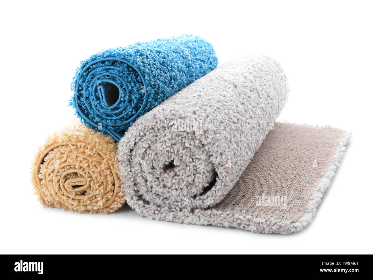 Rolled colorful carpet on white background Stock Photo - Alamy