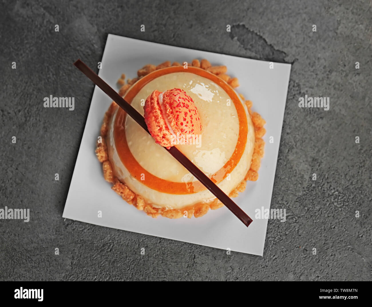 Tasty mousse cake on grunge background Stock Photo - Alamy