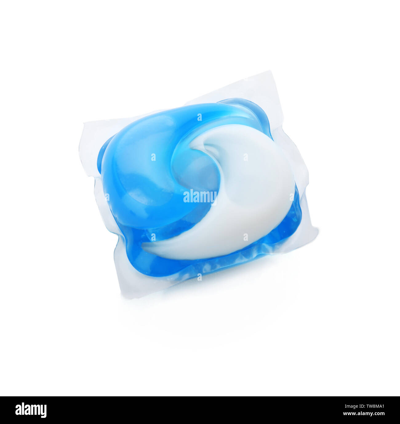 Capsule with laundry detergent on white background Stock Photo - Alamy