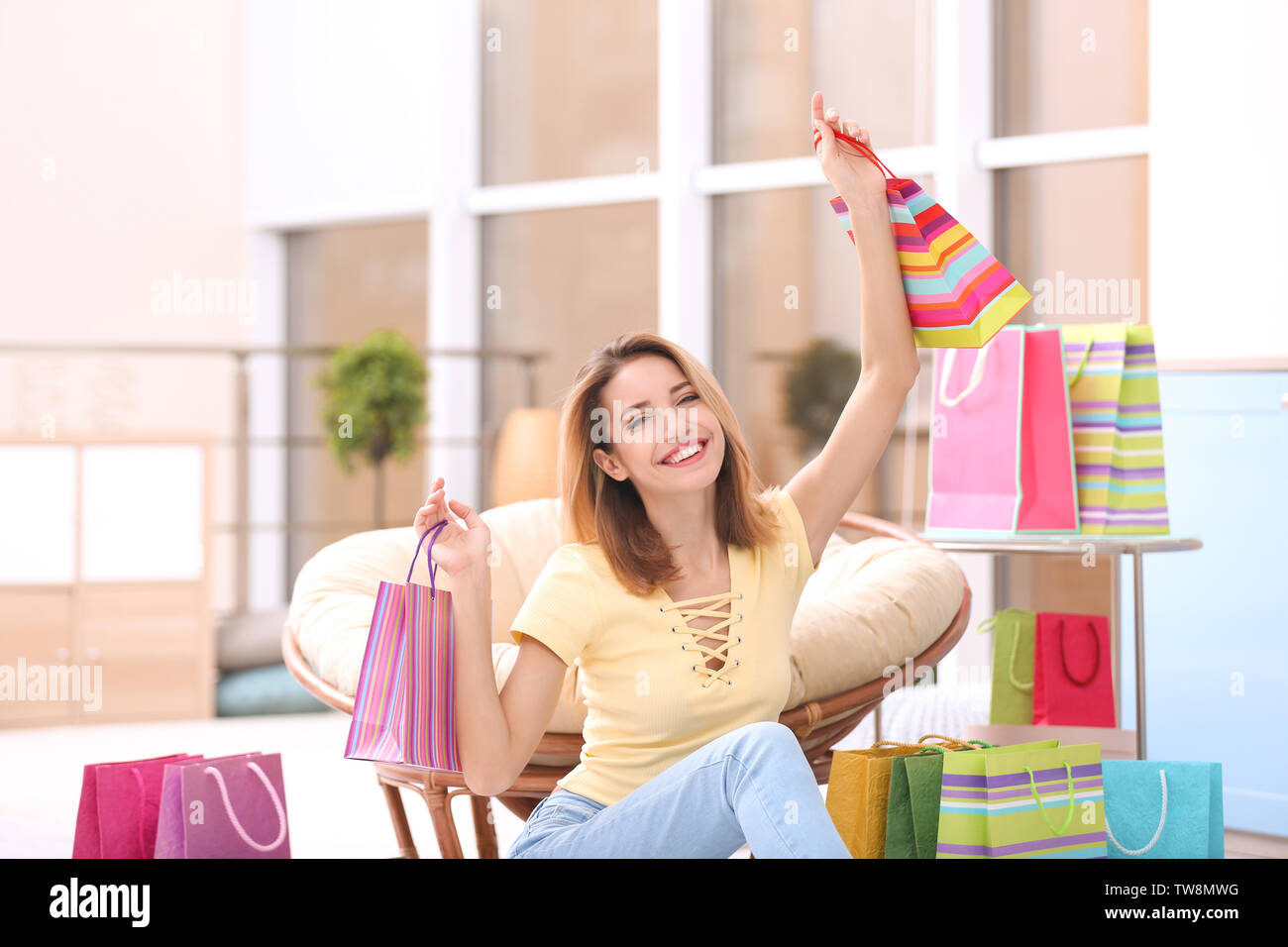 Emotional woman after successful shopping at home Stock Photo - Alamy