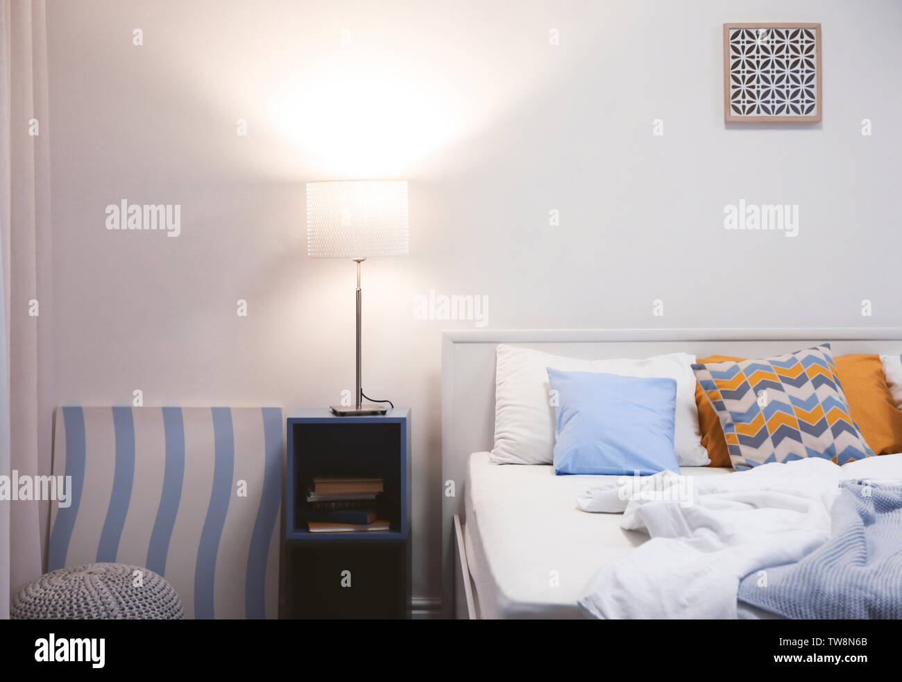 Modern bedroom interior with large bed Stock Photo - Alamy