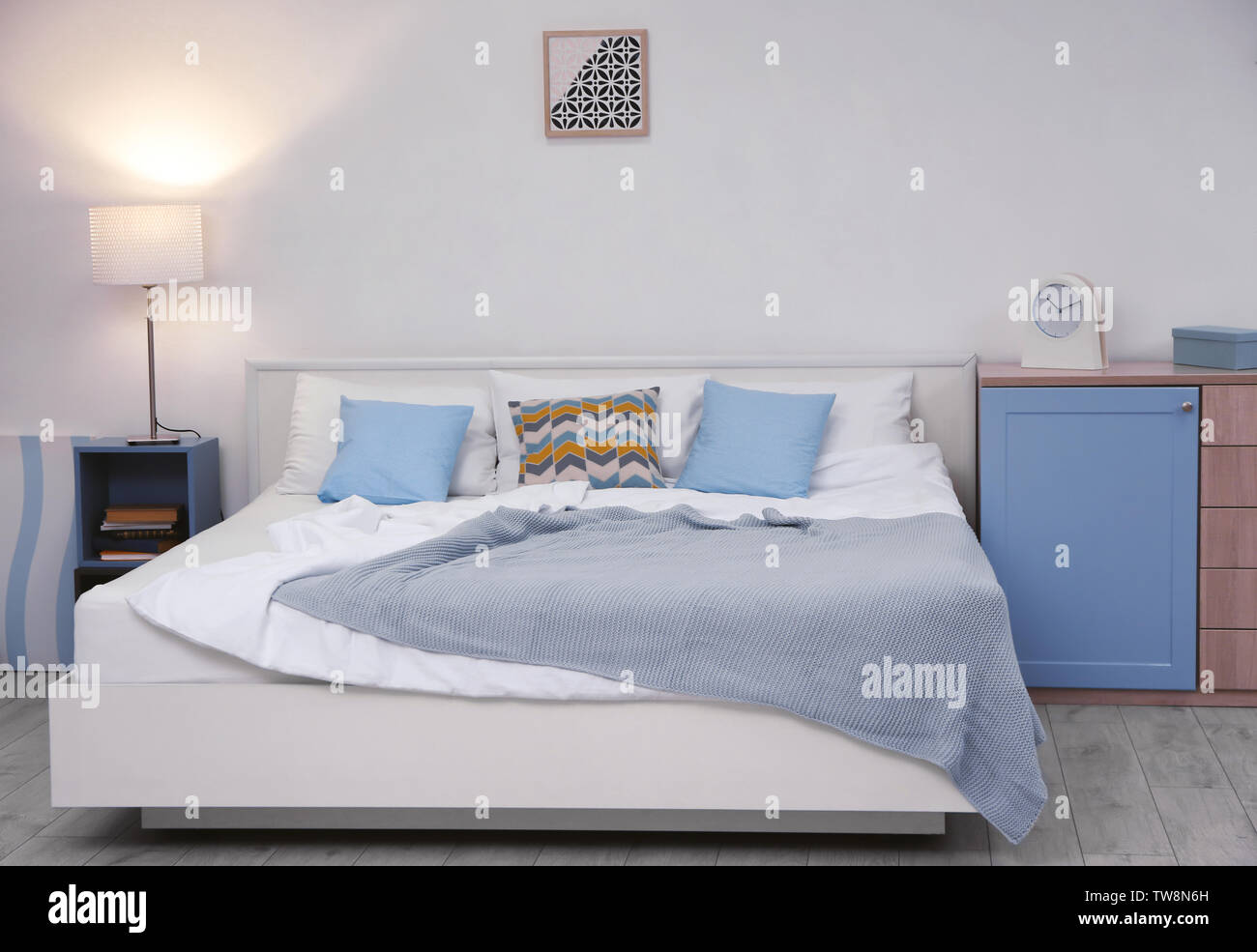 Modern bedroom interior with large bed Stock Photo - Alamy