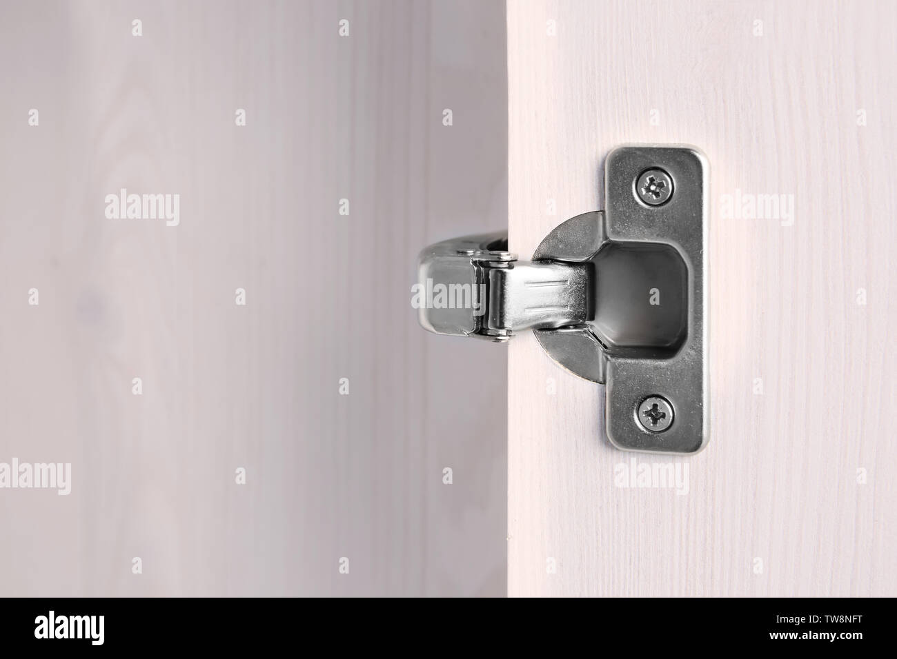 Metal hinges of wardrobe, closeup Stock Photo - Alamy