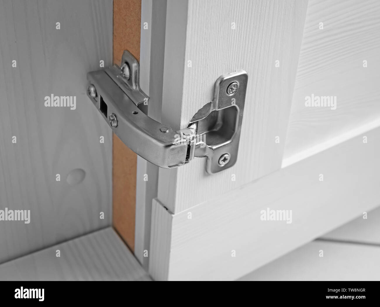 Metal hinges of wardrobe, closeup Stock Photo - Alamy