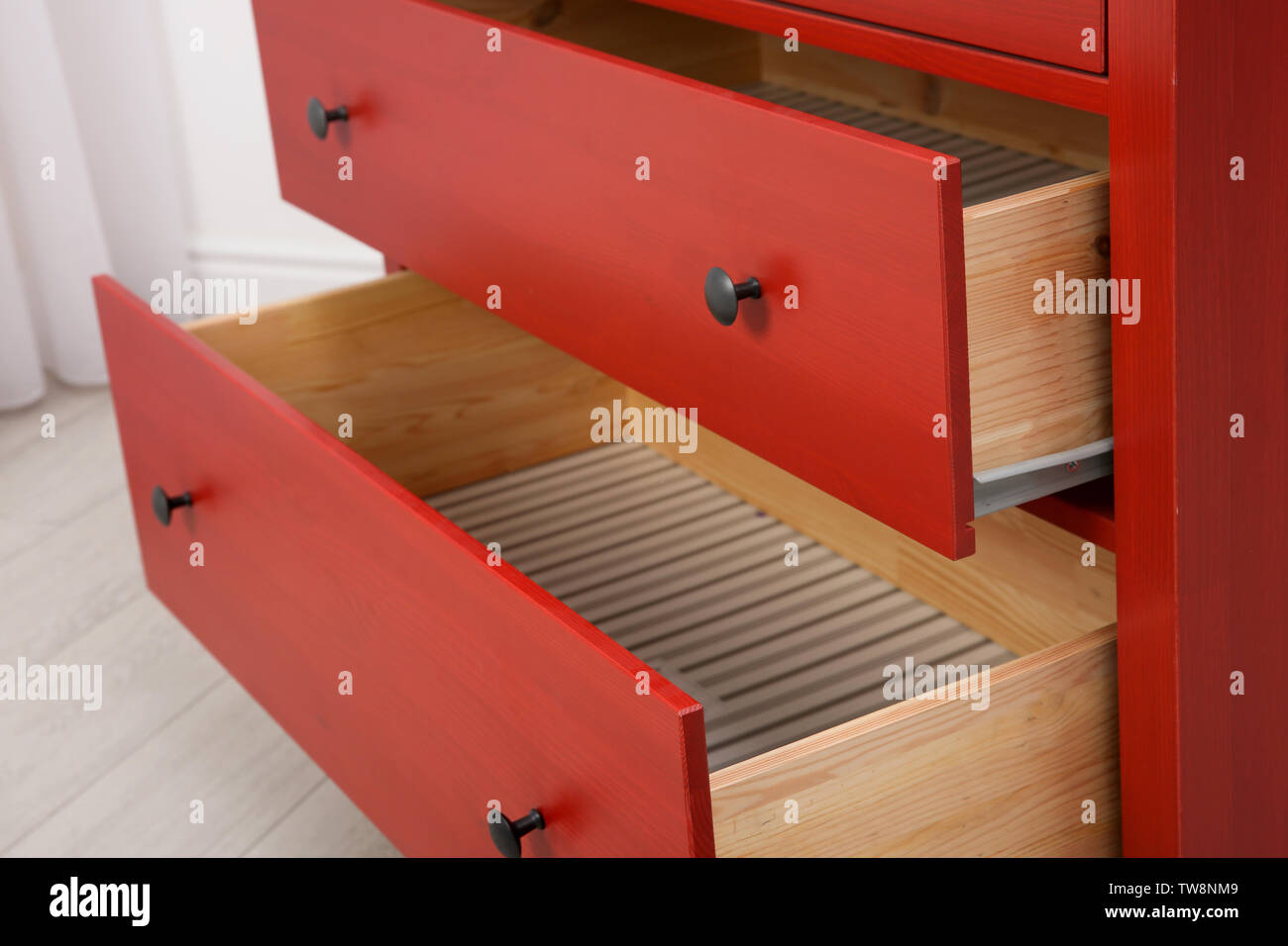 Beautiful wardrobe with open drawers indoors Stock Photo - Alamy