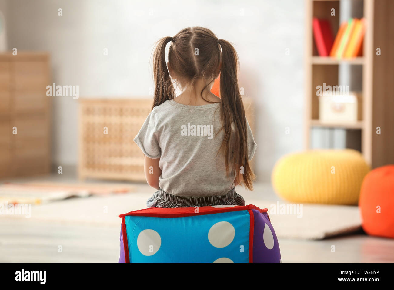 Lonely little girl at home. Autism concept Stock Photo - Alamy