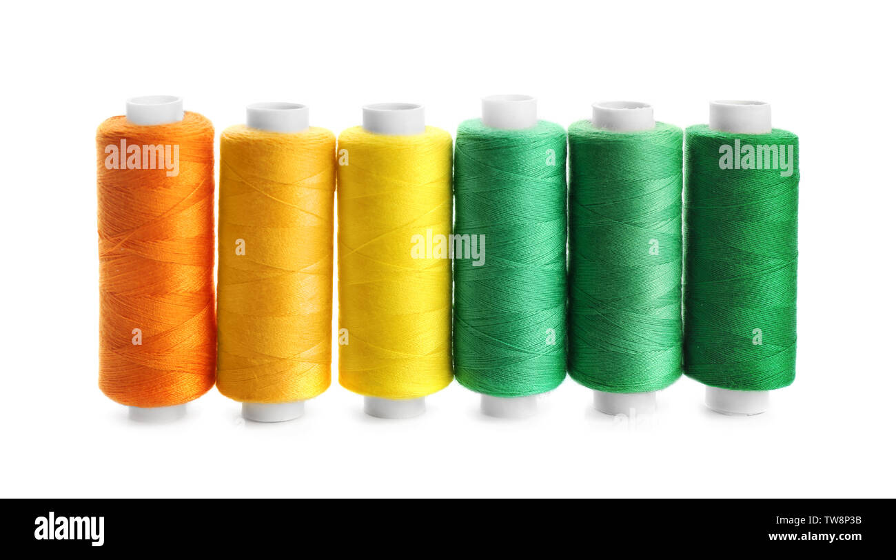 Colorful sewing threads on white background Stock Photo - Alamy