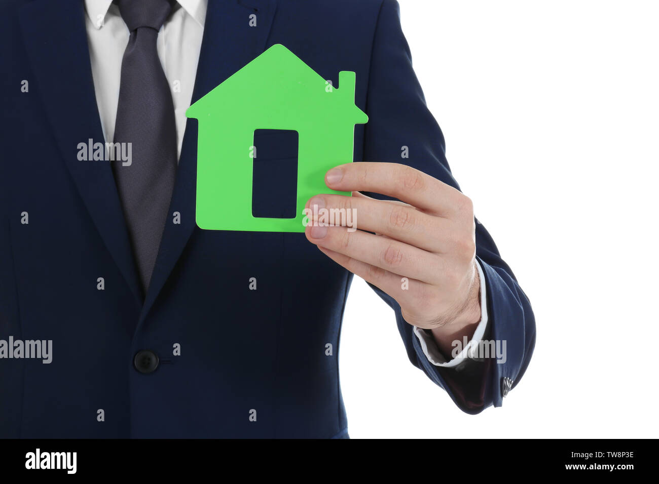 Real estate agent holding house model on white background Stock Photo ...