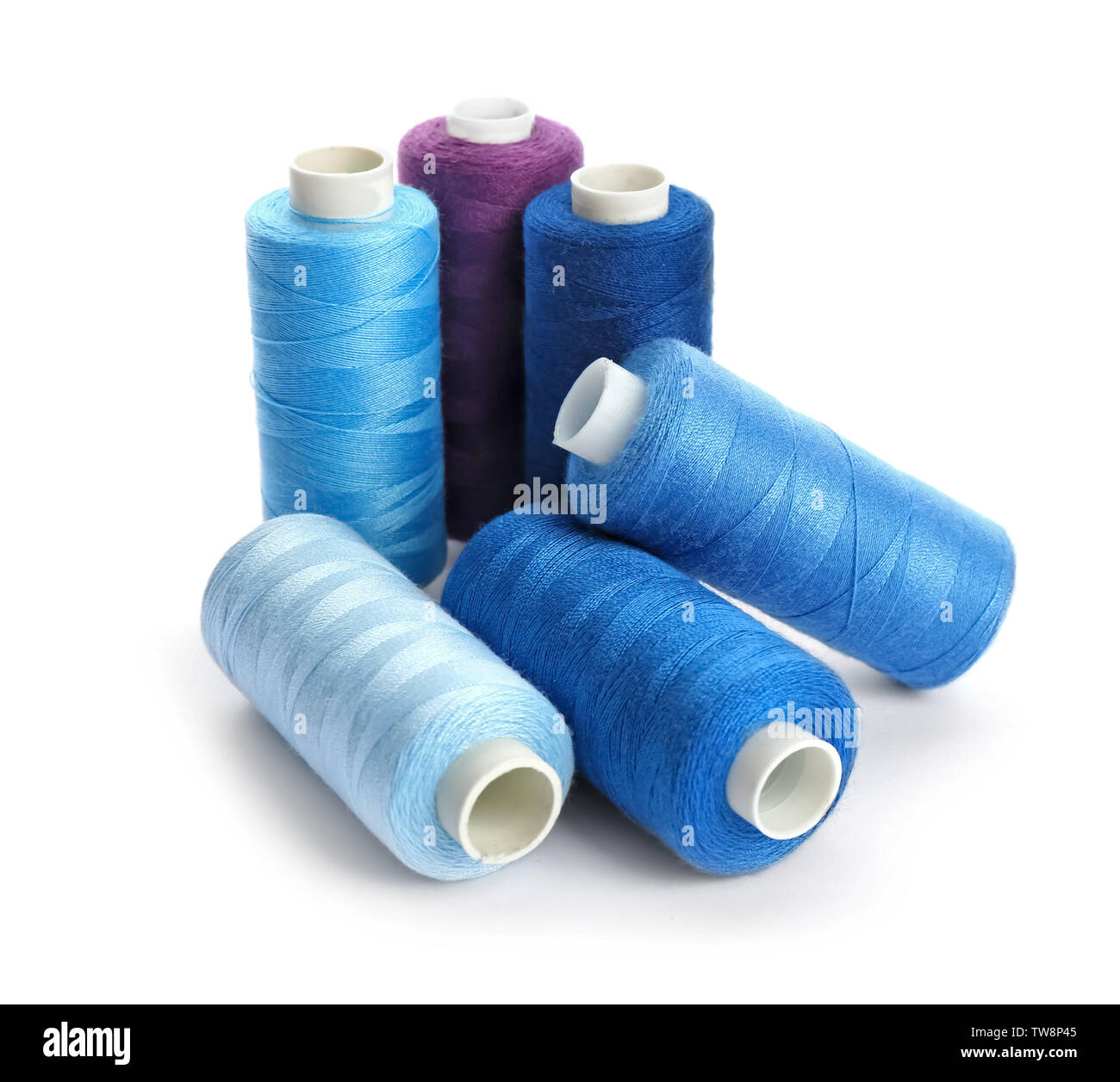 Colorful sewing threads on white background Stock Photo - Alamy