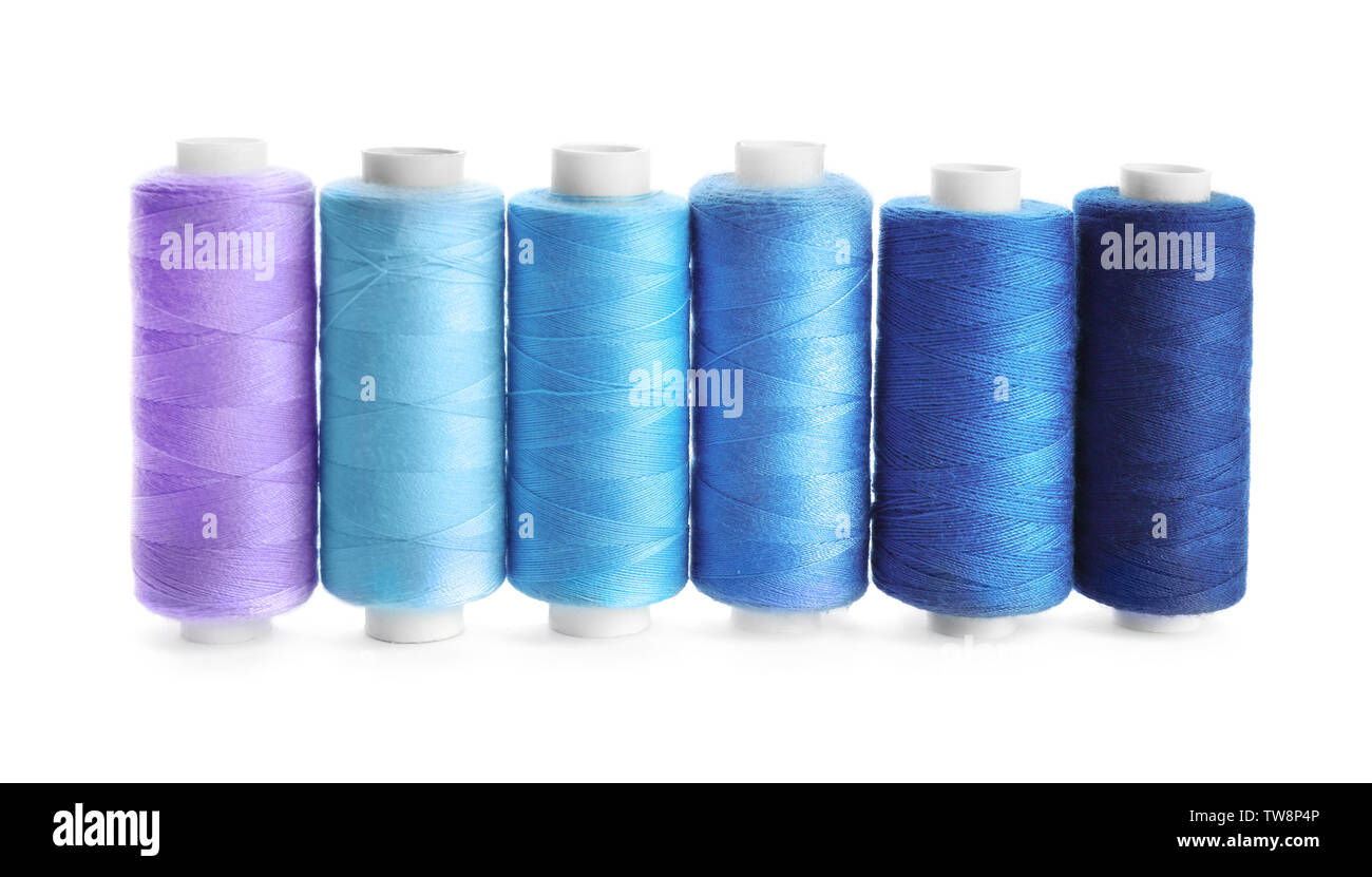 Colorful sewing threads on white background Stock Photo - Alamy