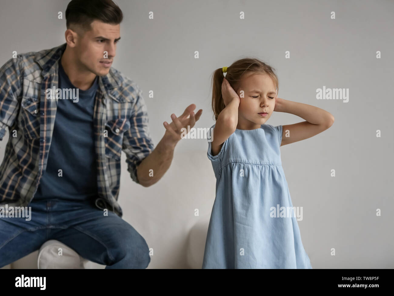Man scolding his daughter at home Stock Photo - Alamy