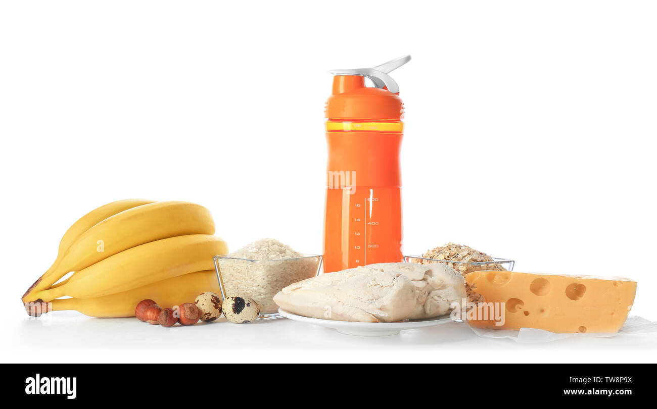 Protein shake in bottle and products on white background Stock Photo ...