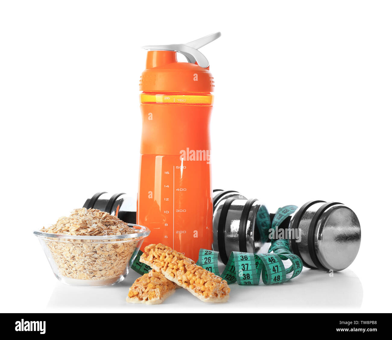 Protein shake in bottle, products and dumbbells with measuring tape on ...