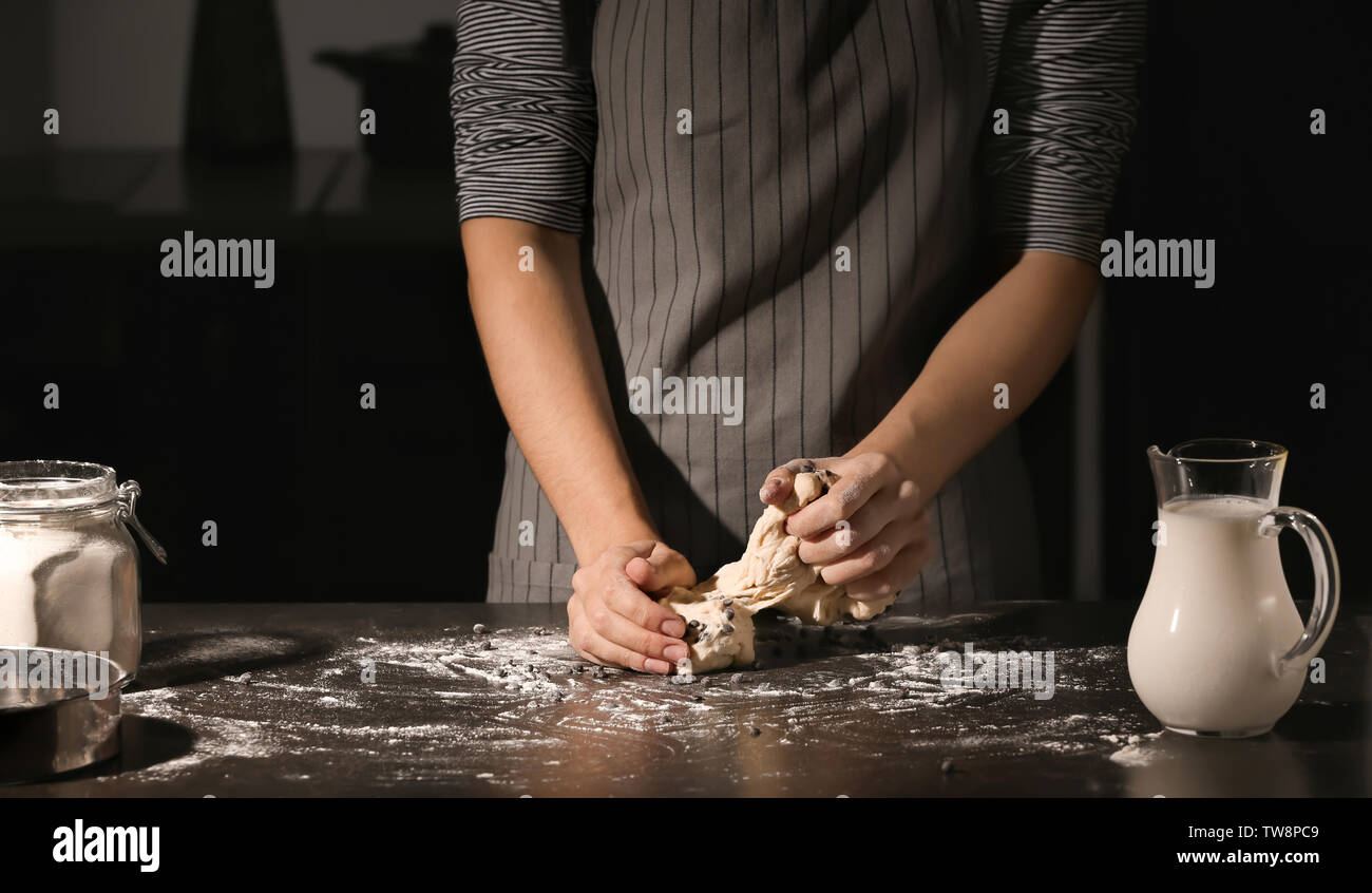 Woman kneading chocolate dough cake hi-res stock photography and images ...