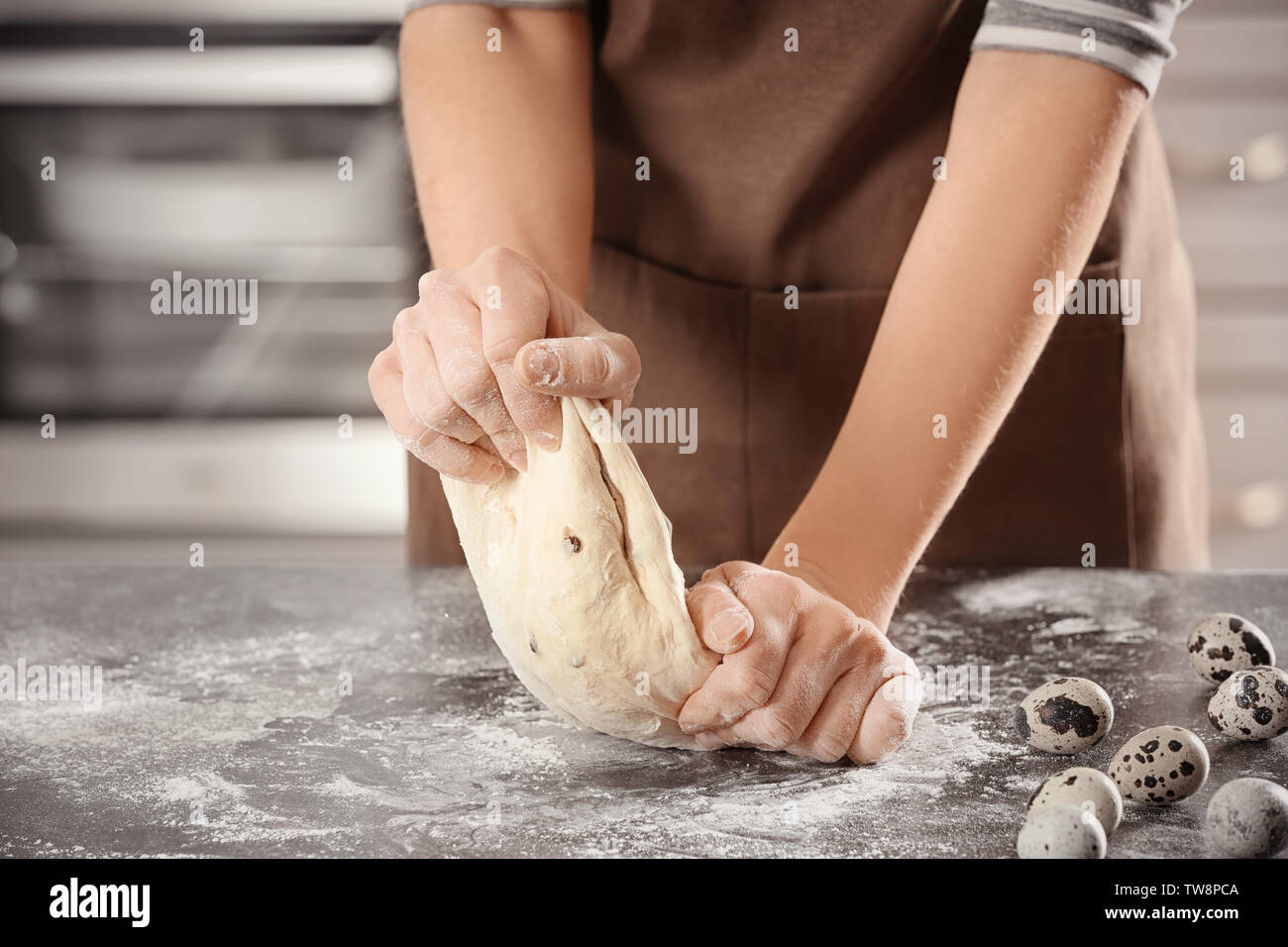 Woman kneading chocolate dough cake hi-res stock photography and images ...