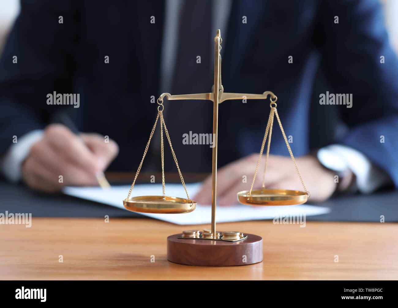 Scales of justice on table in notary's office Stock Photo - Alamy