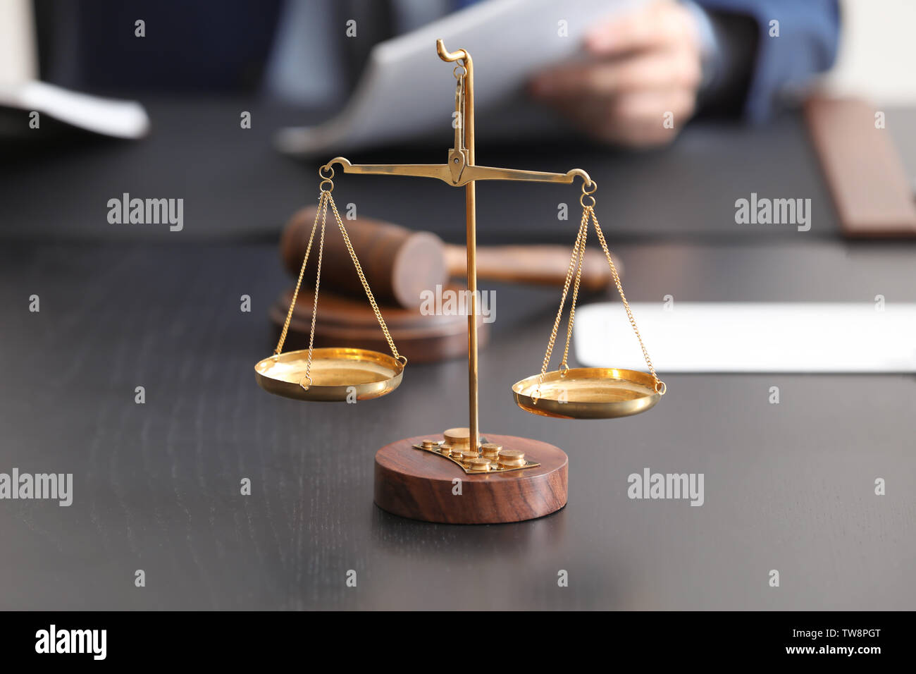 Scales of justice on table in notary's office Stock Photo - Alamy